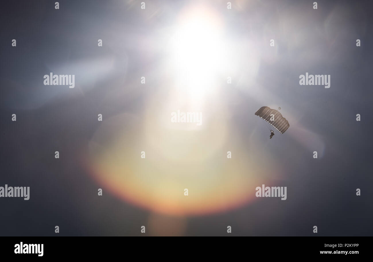 A pararescueman (PJ) glides through the air during a high-altitude, low ...