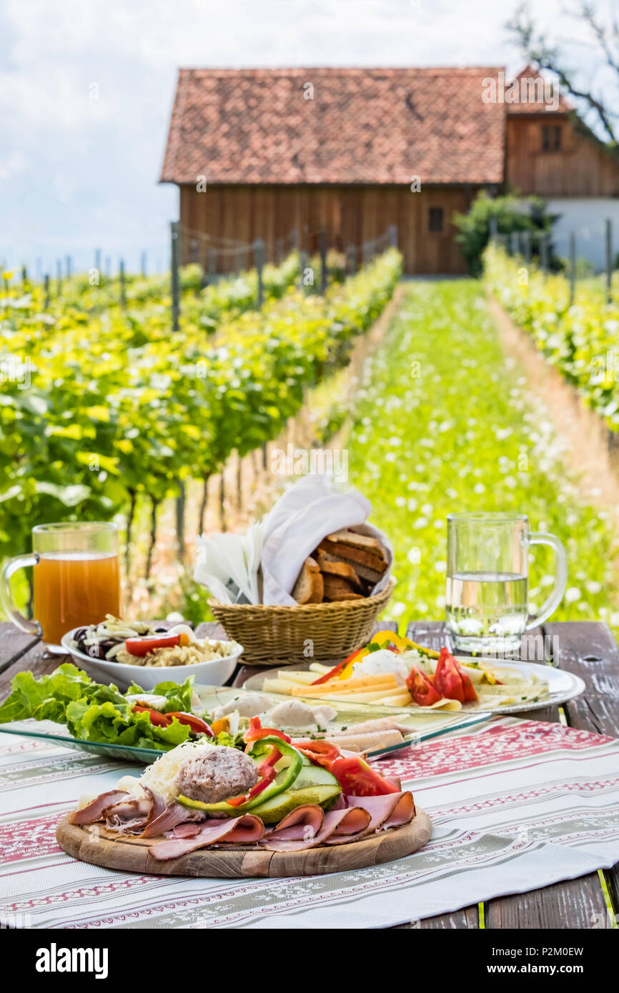 Brettljause, traditional cold plate with meat, cheese, fish, vegetable ...