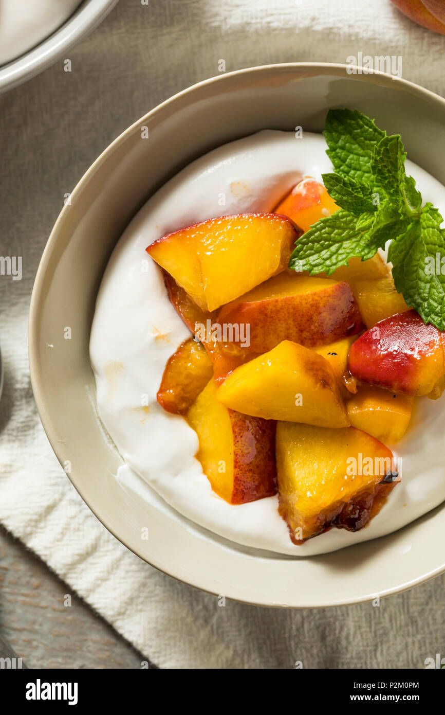 Homemade Sweet Peaches and Cream with Mint Stock Photo - Alamy