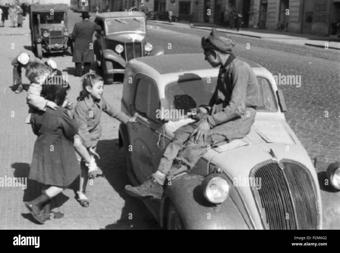 . English: Naples, Boy talking with little girls . 13 May 1946 ...