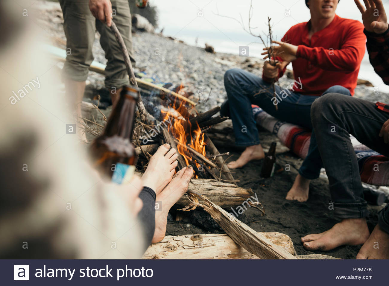 Man relaxing beach barefoot hi-res stock photography and images - Alamy