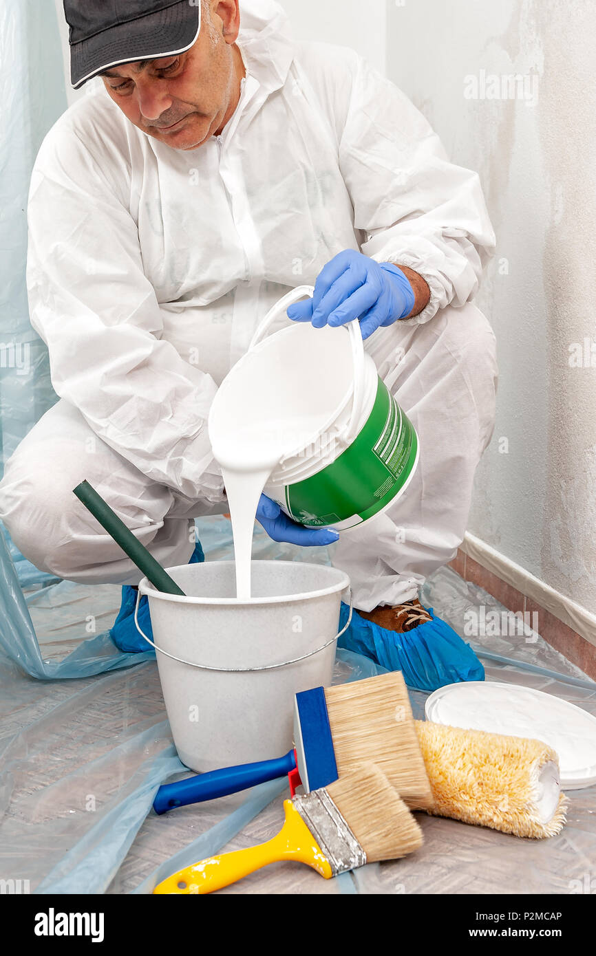 Hand craftsman pours paint container hi-res stock photography and ...