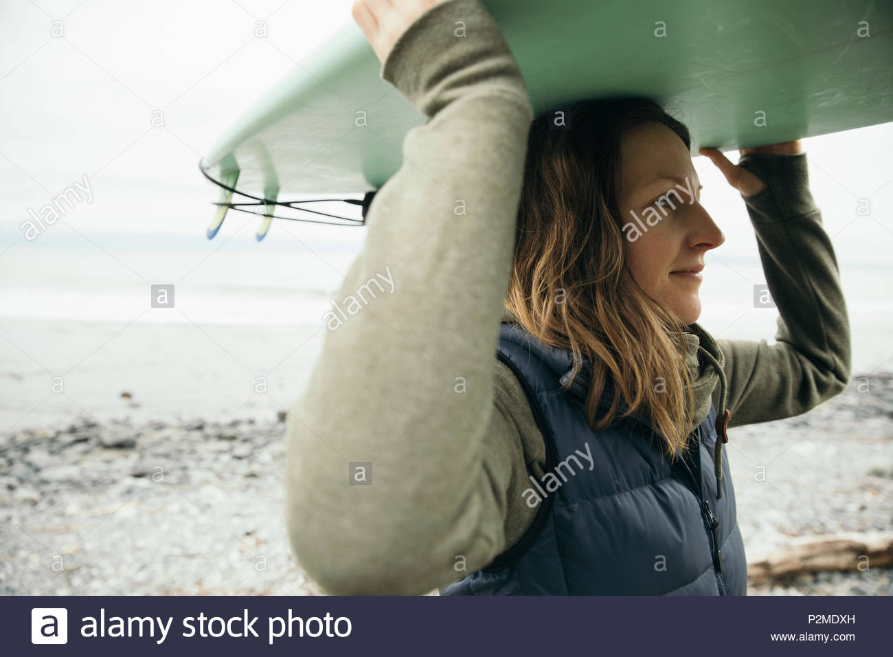 Surfer carrying a surfboard hi-res stock photography and images - Alamy
