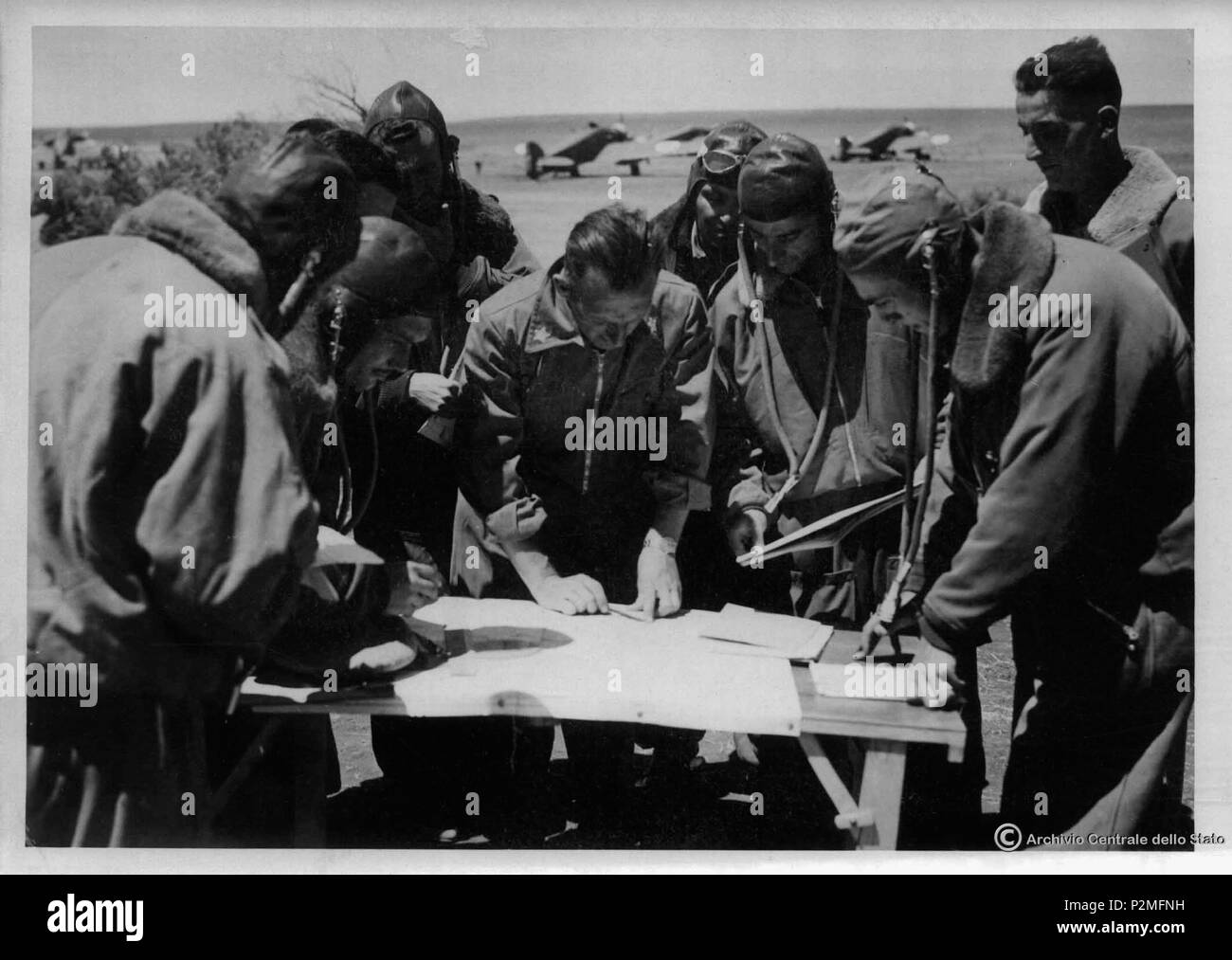 . English: Italian pilots in Egypt studying map in September 1940. 9 ...