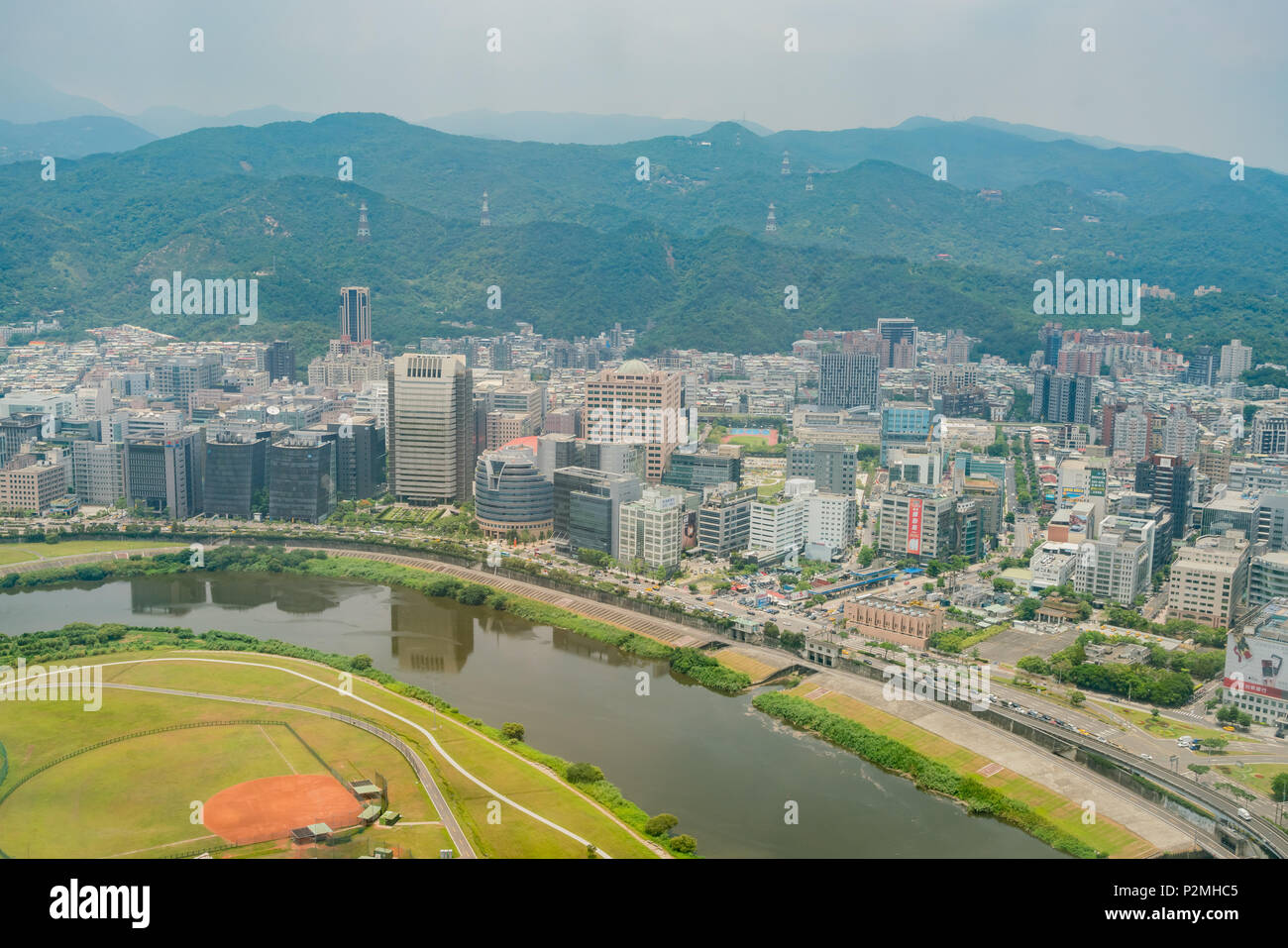 Aerial view of the beautiful Taipei City, from an airplane window seat ...