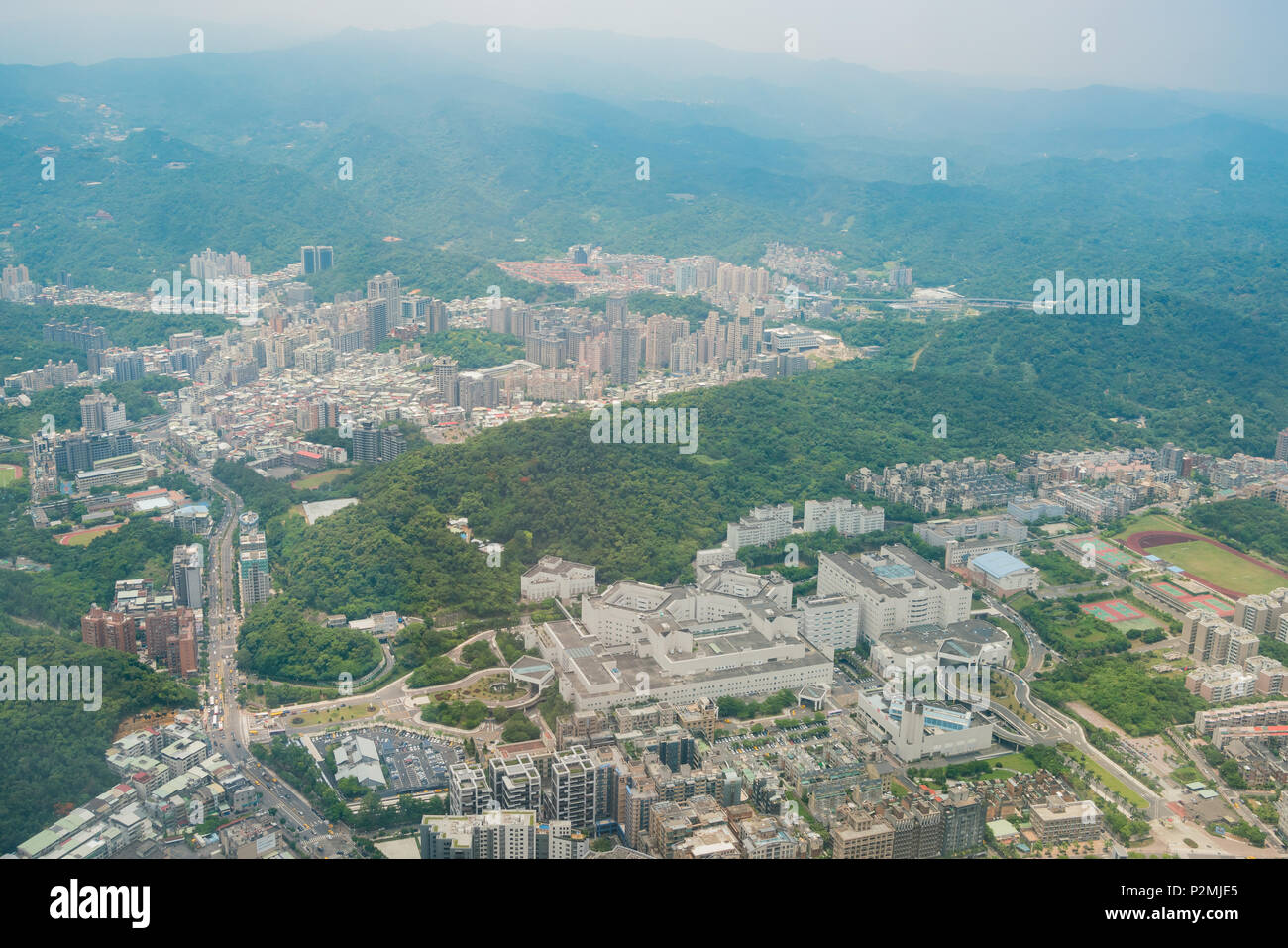 Aerial view of the beautiful Taipei City, from an airplane window seat ...