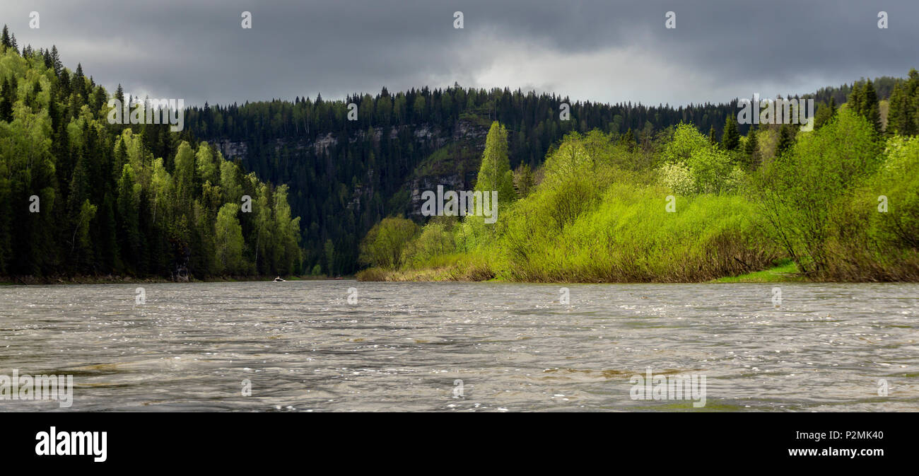 panoramic landscape of the Ural river Usva with coastal cliffs in the ...