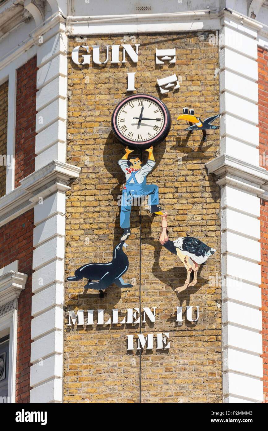 Guinness clock advertising on wall of the archway tavern archway hi-res ...