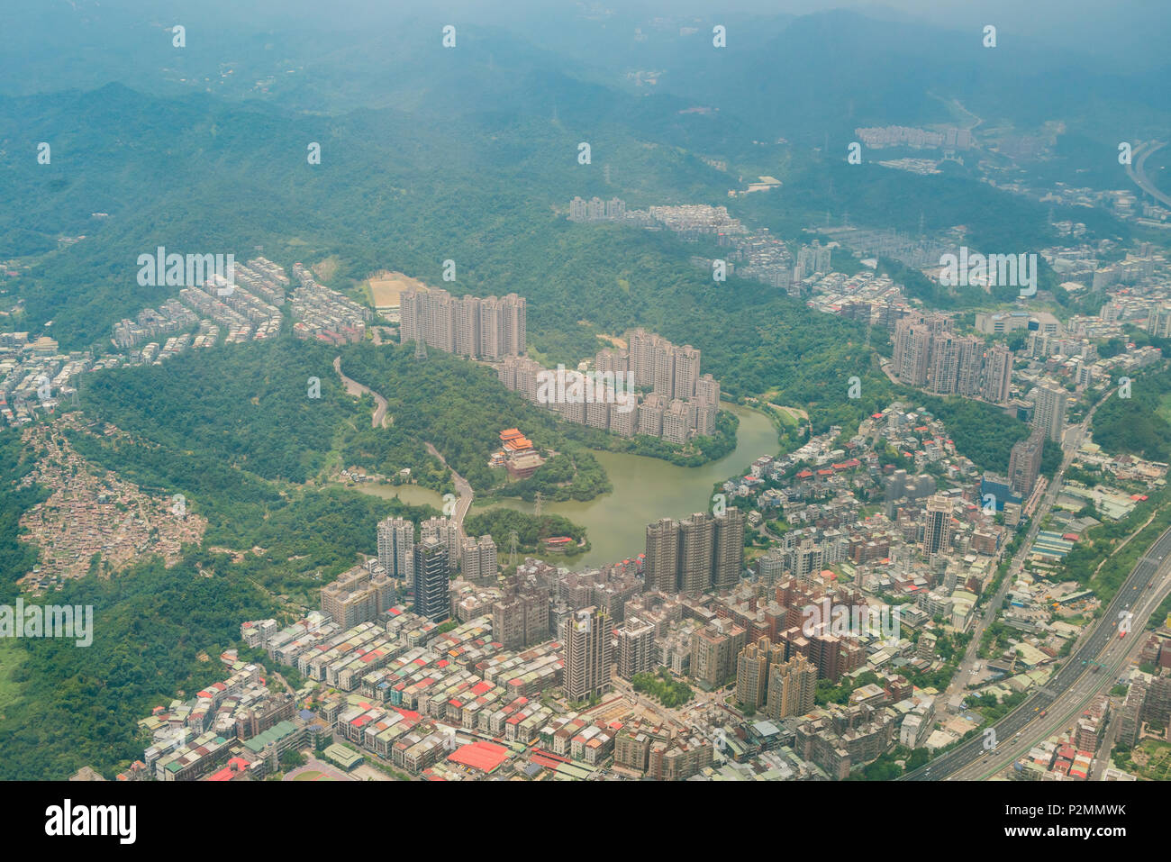 Aerial view of the beautiful Taipei City, from an airplane window seat ...