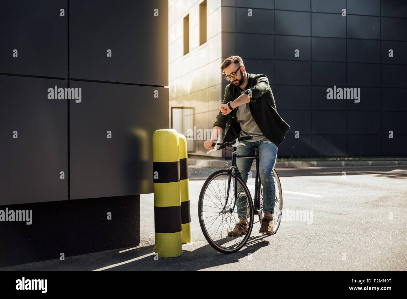 Man looking back cycling hi-res stock photography and images - Alamy
