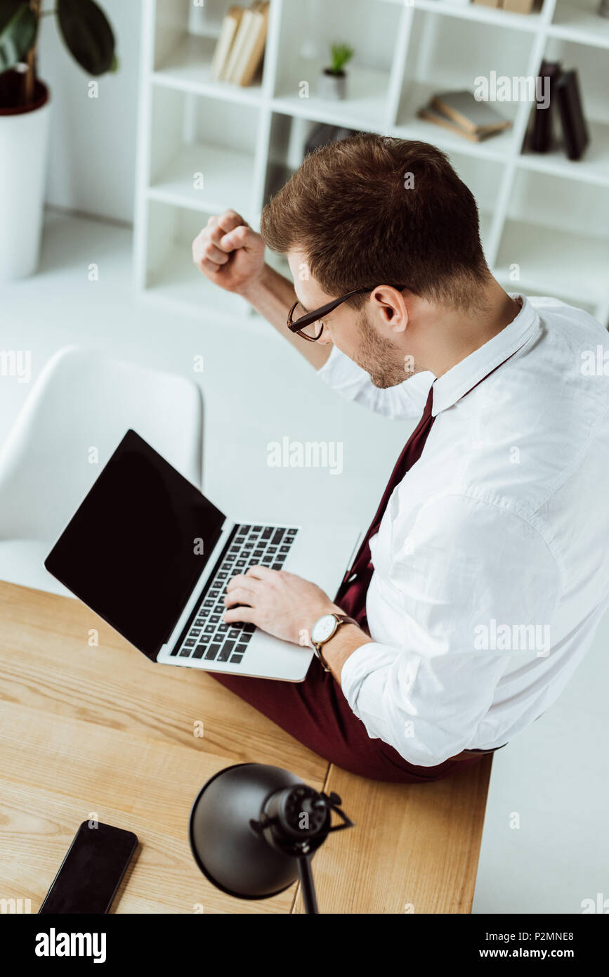 successful businessman looking at screen of laptop Stock Photo - Alamy