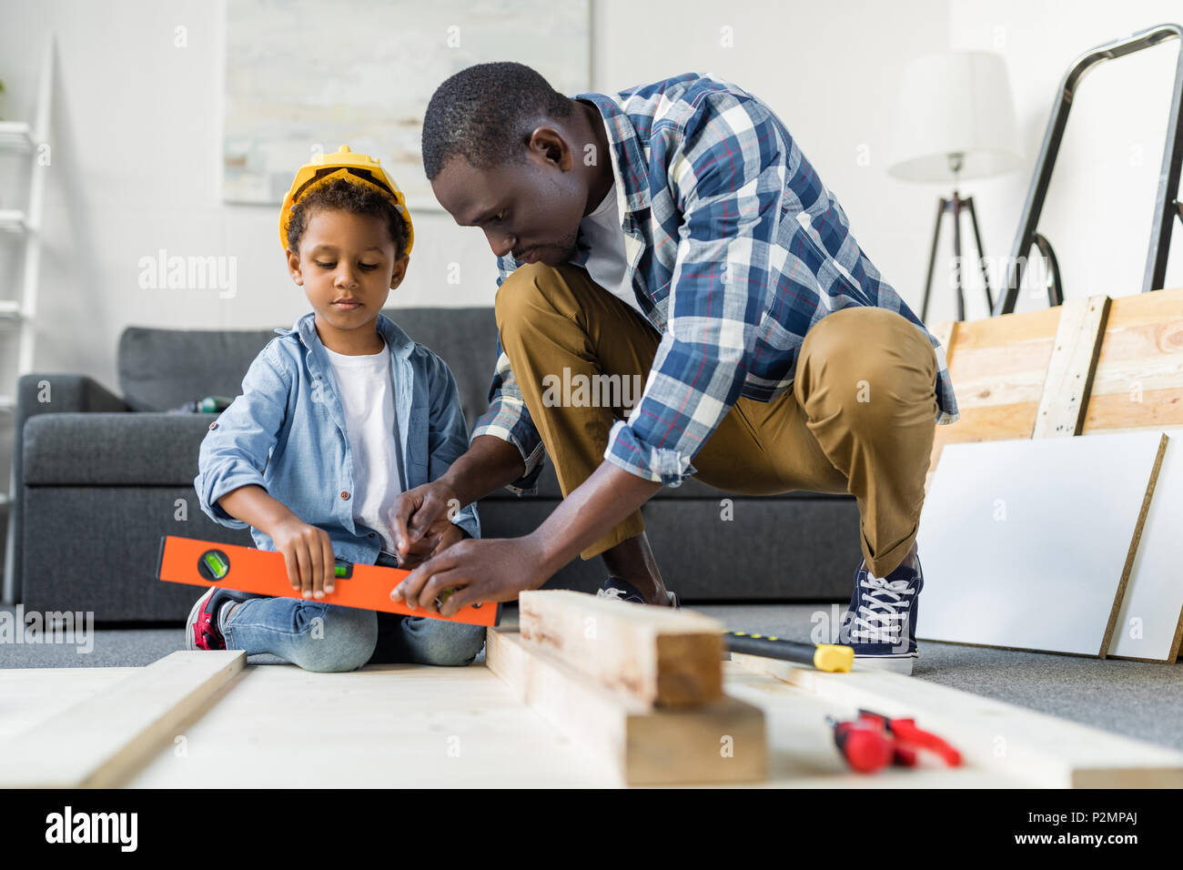 african-american father teaching his son how to use tools Stock Photo ...