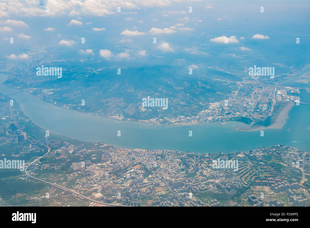 Aerial view of the beautiful Taipei City, from an airplane window seat ...