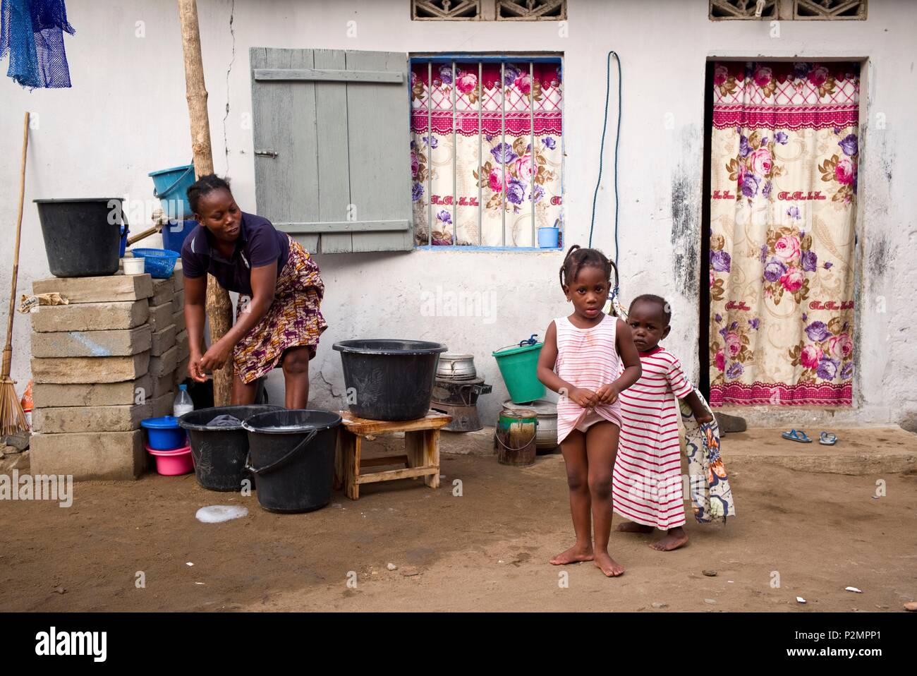Togo, Lome, a mother and these two children in a working class ...