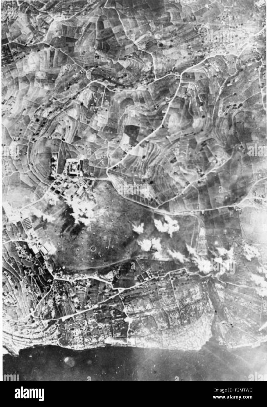 . English: Vertical aerial photograph taken during a bombing attack by ...