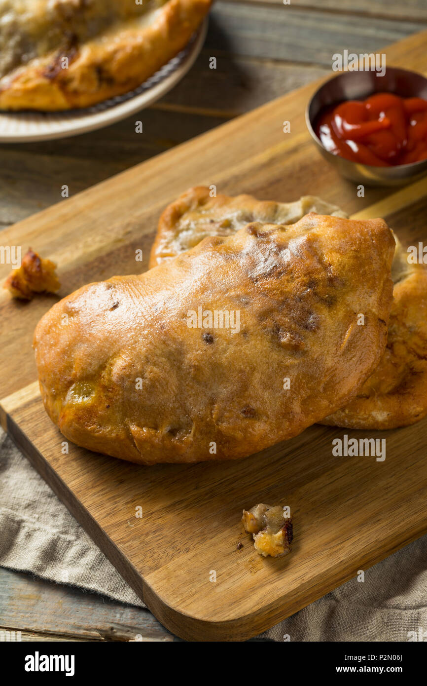 Homemade Upper MIchigan Pasty Meat Pie with Ketchup Stock Photo - Alamy