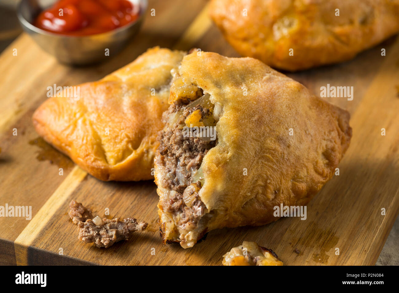 Homemade Upper MIchigan Pasty Meat Pie with Ketchup Stock Photo - Alamy