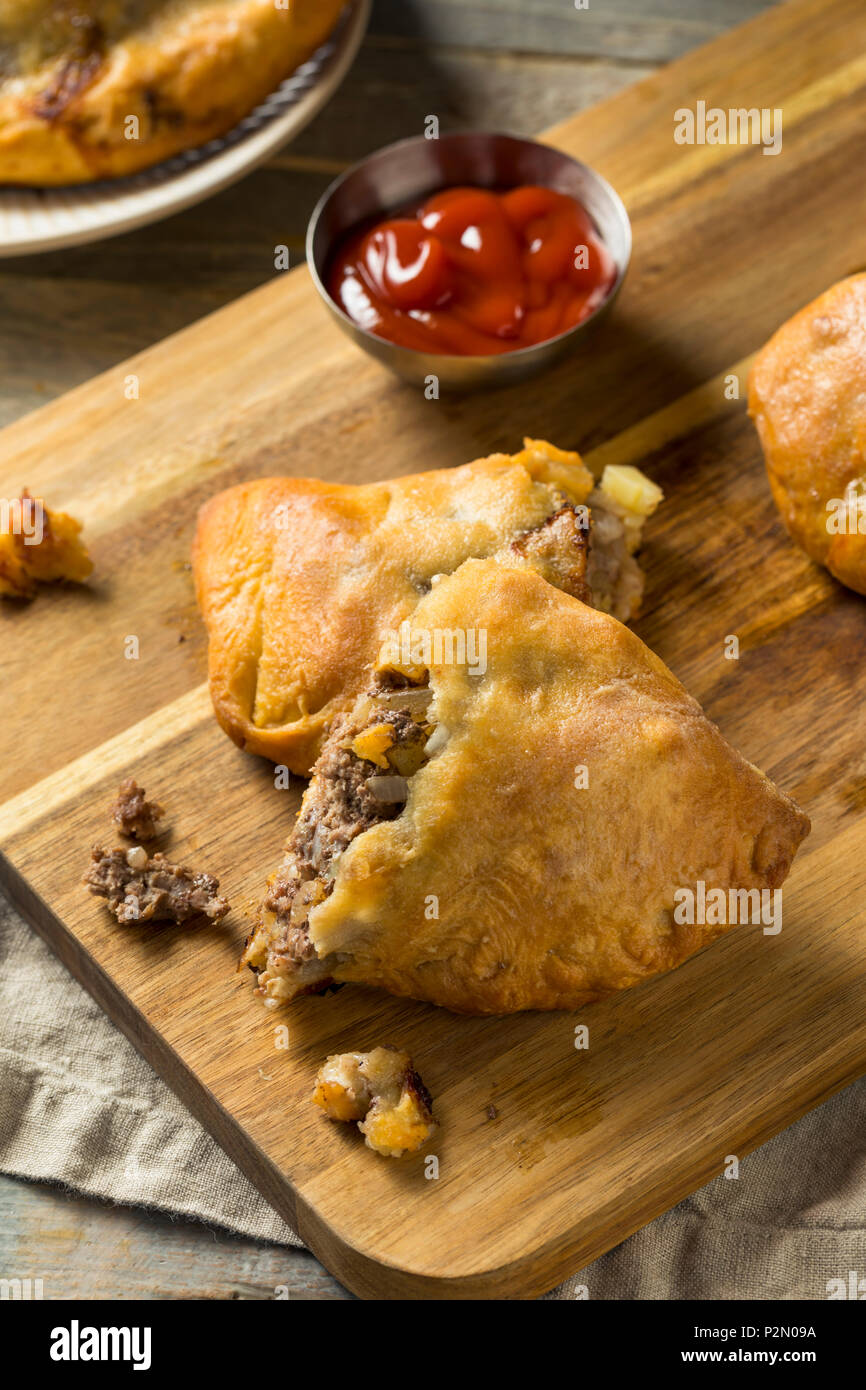 Homemade Upper MIchigan Pasty Meat Pie with Ketchup Stock Photo - Alamy