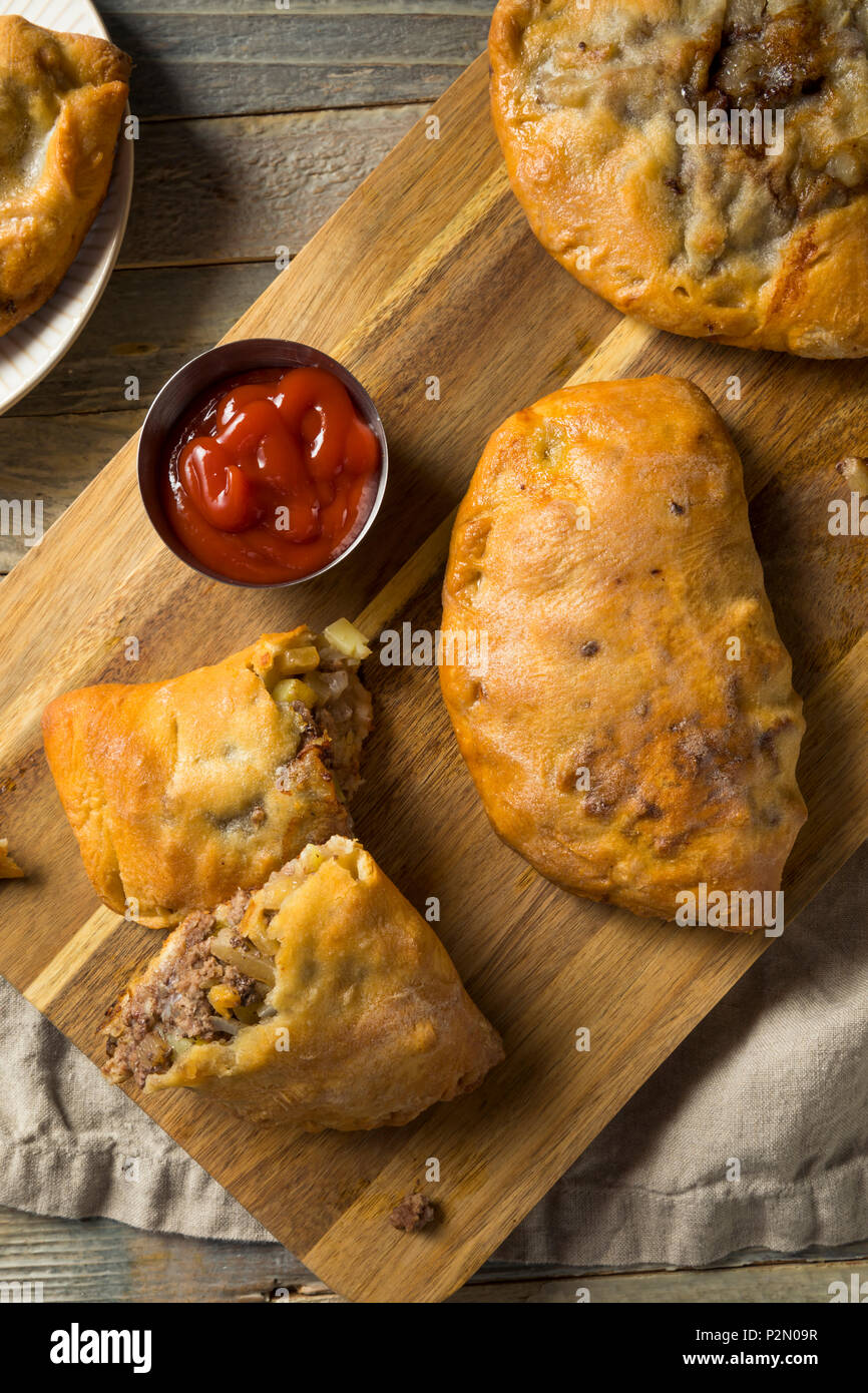 Homemade Upper MIchigan Pasty Meat Pie with Ketchup Stock Photo - Alamy