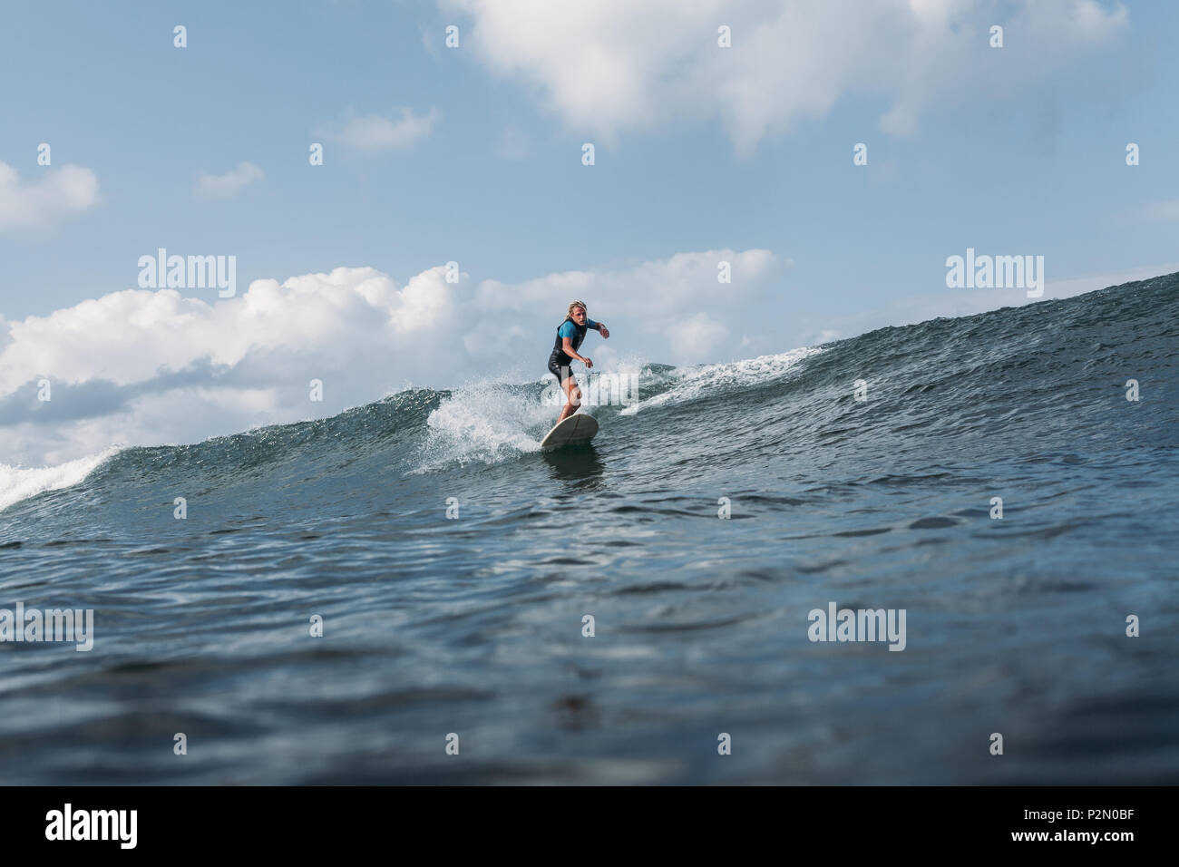 Man riding wave hi-res stock photography and images - Alamy
