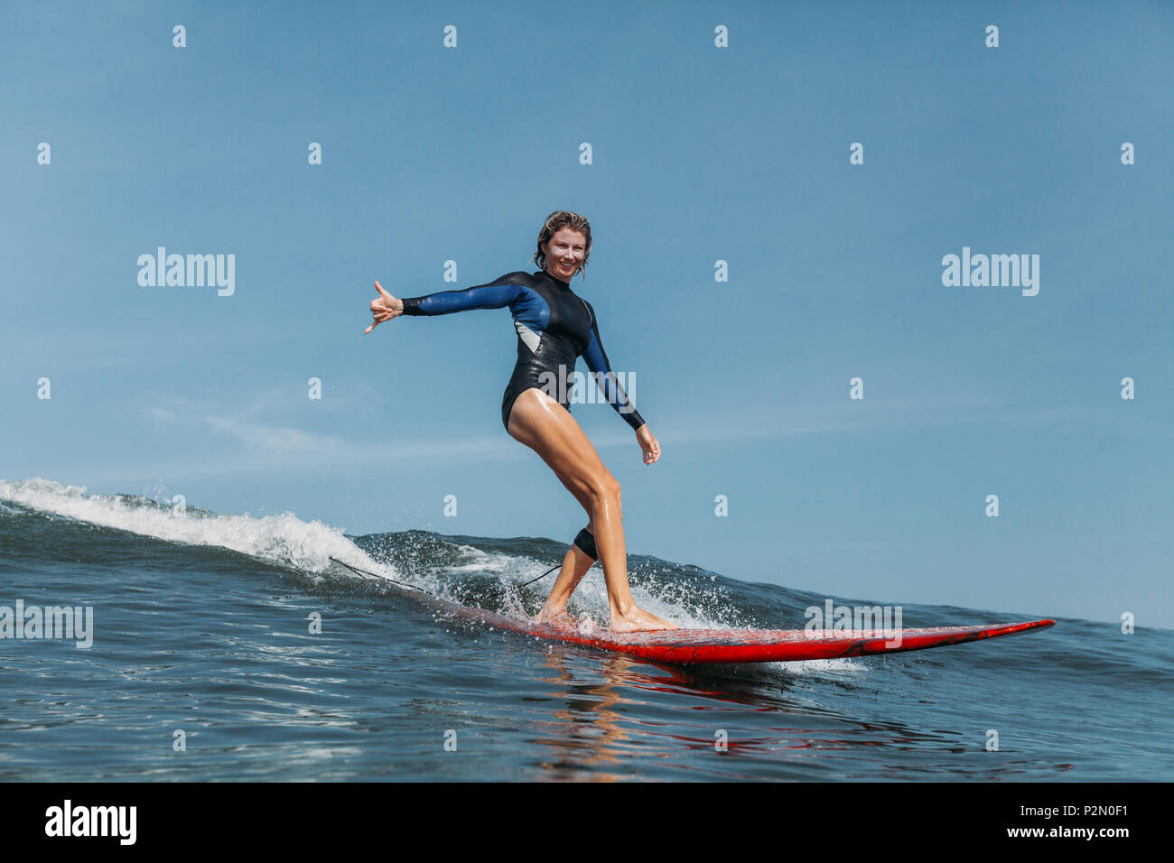 Girl riding wave hi-res stock photography and images - Alamy