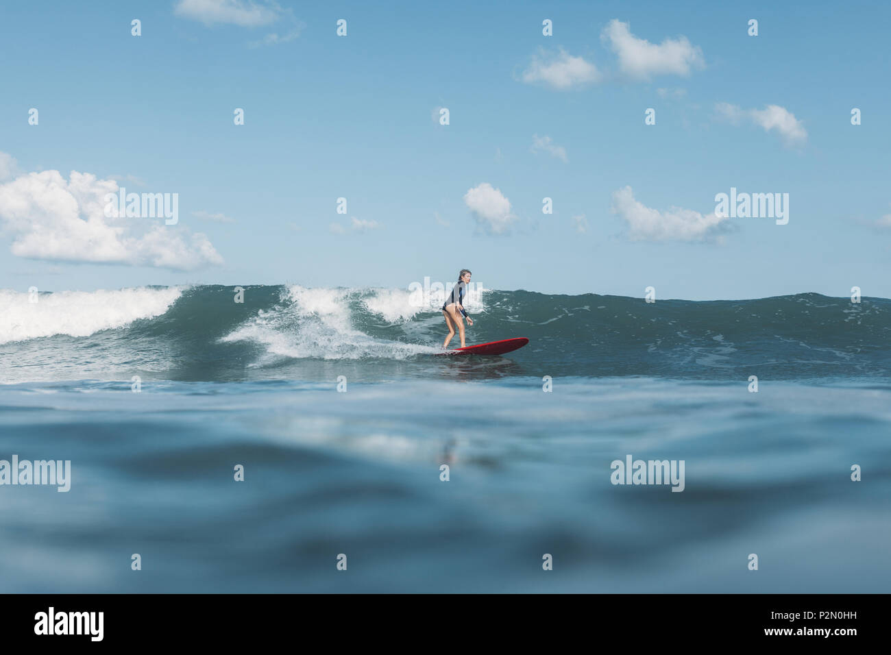 Girl riding wave hi-res stock photography and images - Alamy