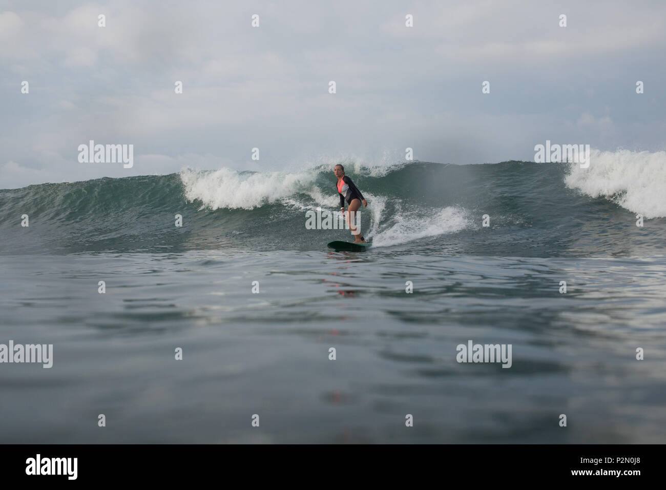 Girl riding wave hi-res stock photography and images - Alamy