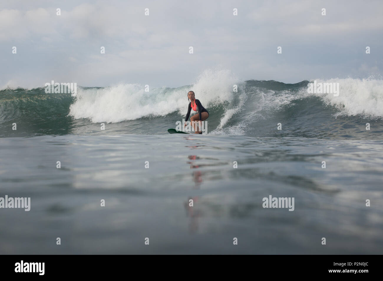 Girl riding wave hi-res stock photography and images - Alamy