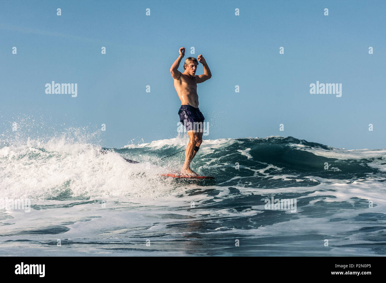 active surfer having fun and riding wave in ocean Stock Photo - Alamy