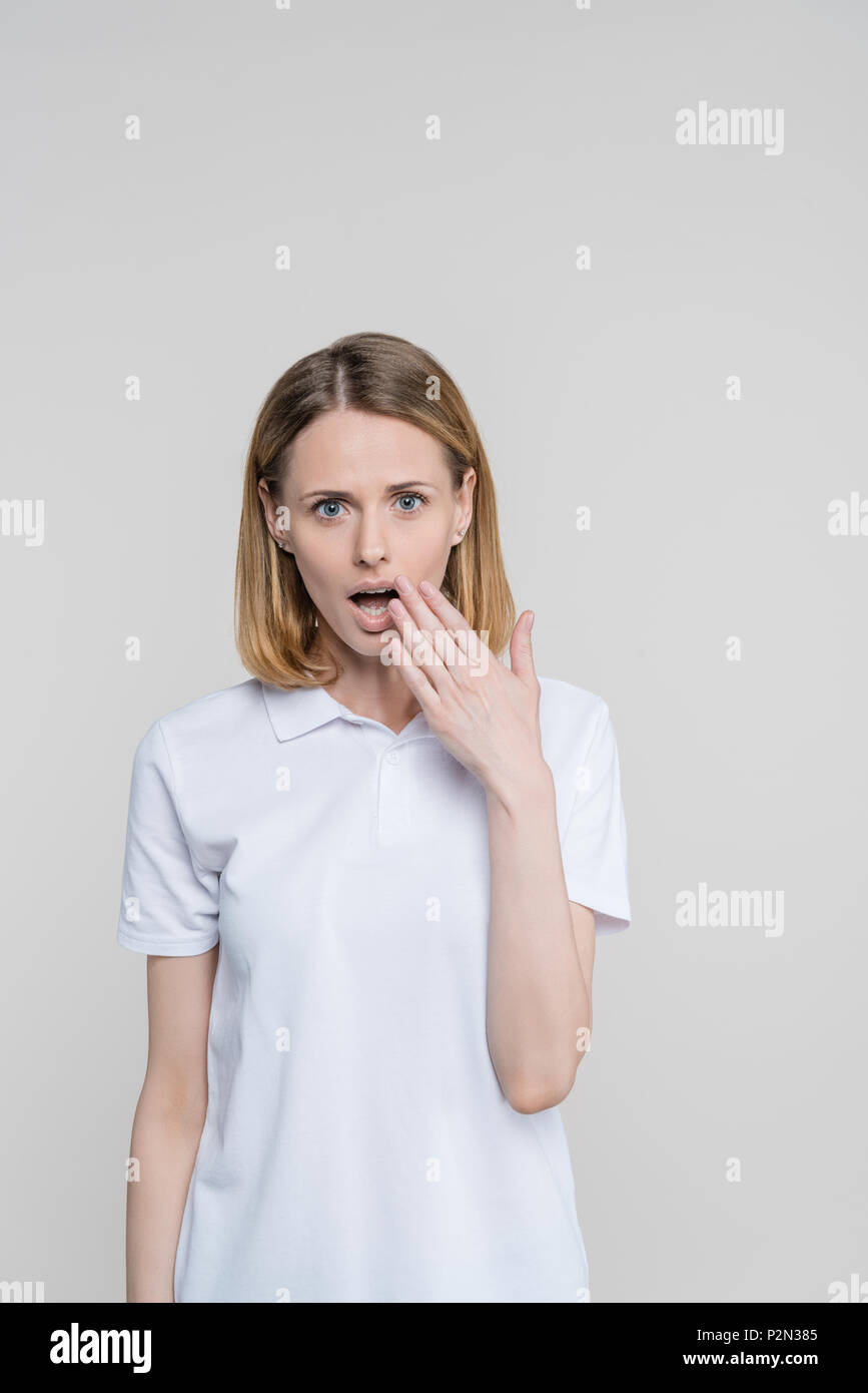 shocked beautiful woman gesturing isolated on grey Stock Photo - Alamy