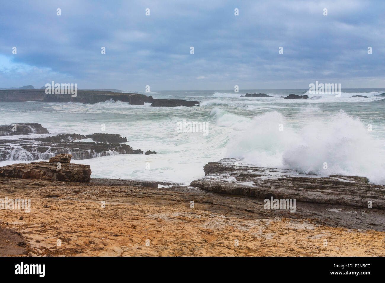 White-capped crashing waves and high surf, with storm coming in, at ...