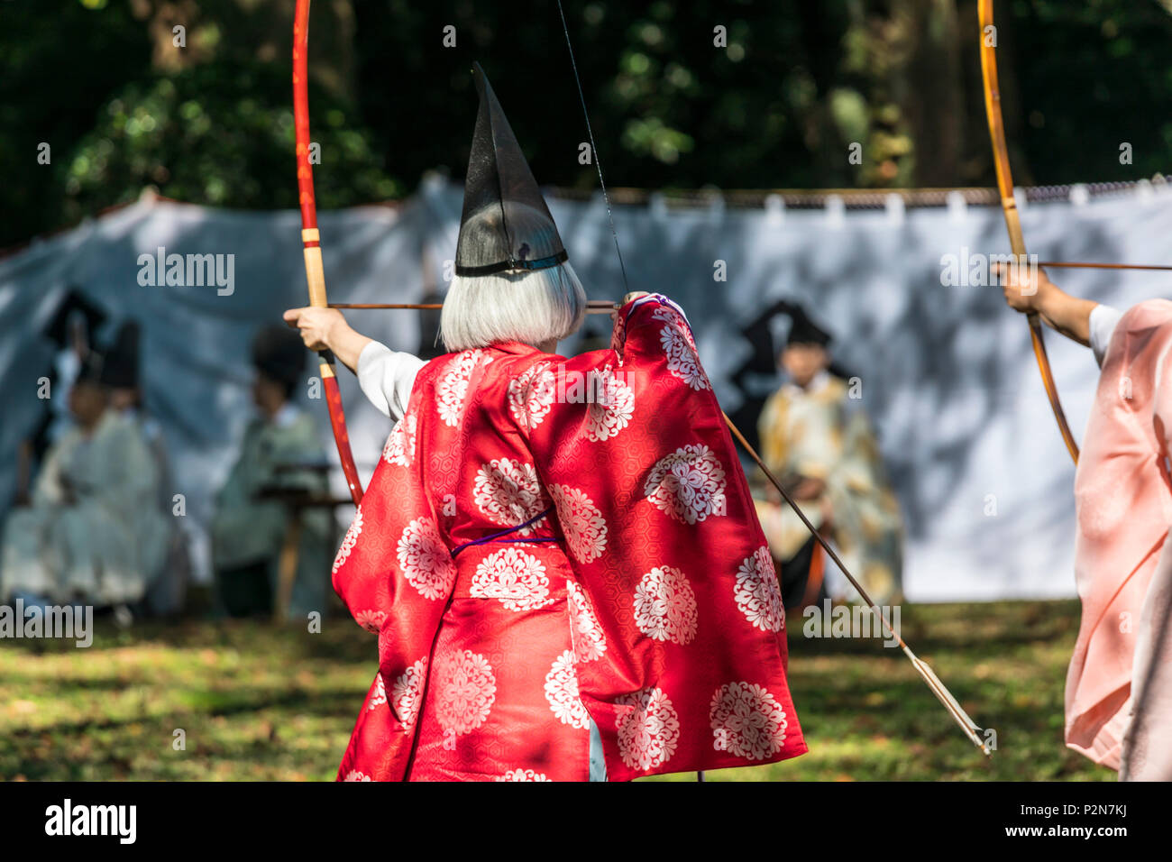 Archer in red costume during Autumn Grand Festival at Meiji Shrine ...