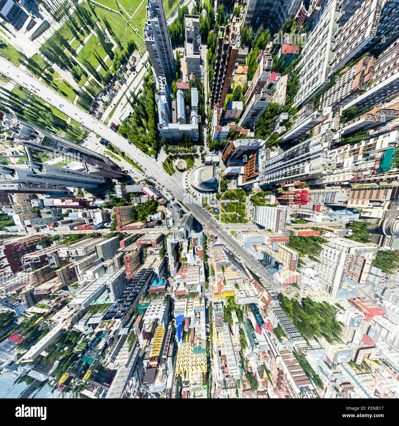 Aerial city view with crossroads, roads, houses, buildings, parks and ...
