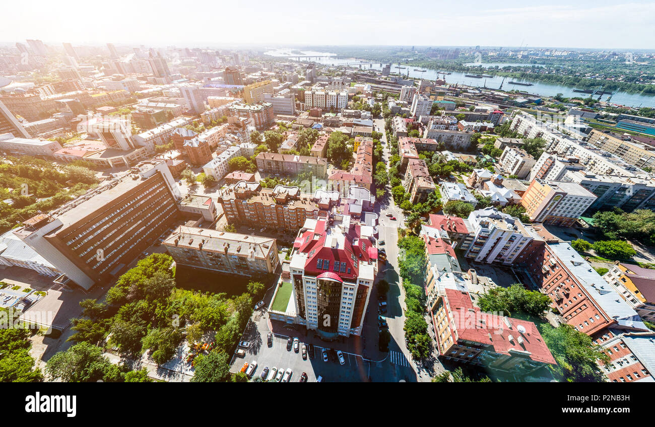 Aerial city view with crossroads, roads, houses, buildings, parks and ...