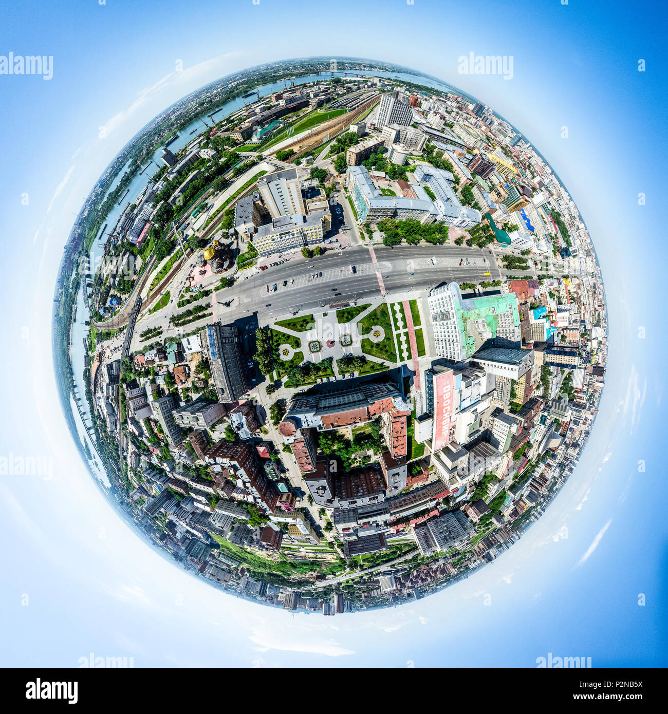 Aerial city view with crossroads and roads, houses, buildings, parks ...