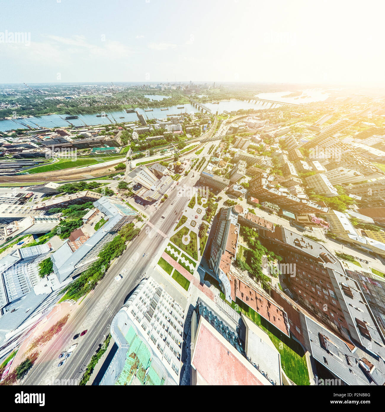 Aerial city view with crossroads and roads, houses, buildings, parks ...