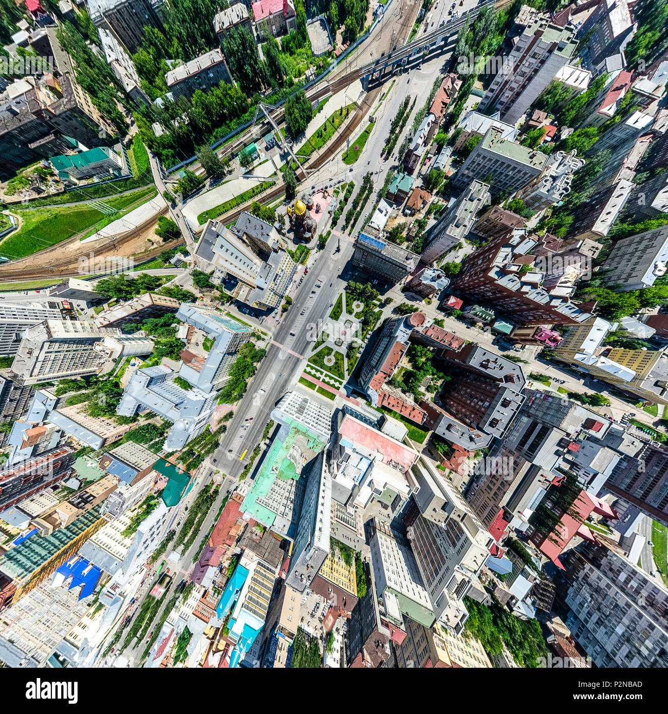 Aerial city view with crossroads and roads, houses, buildings, parks ...