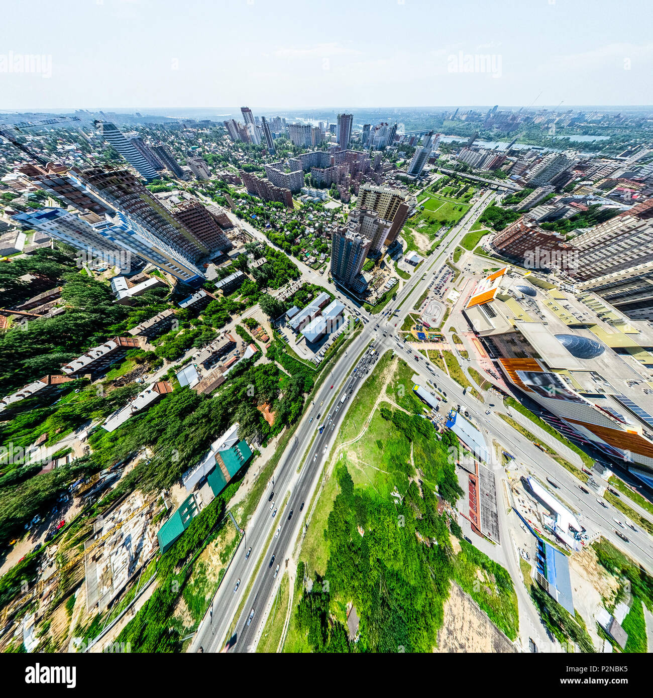 Aerial city view with crossroads and roads, houses, buildings, parks ...