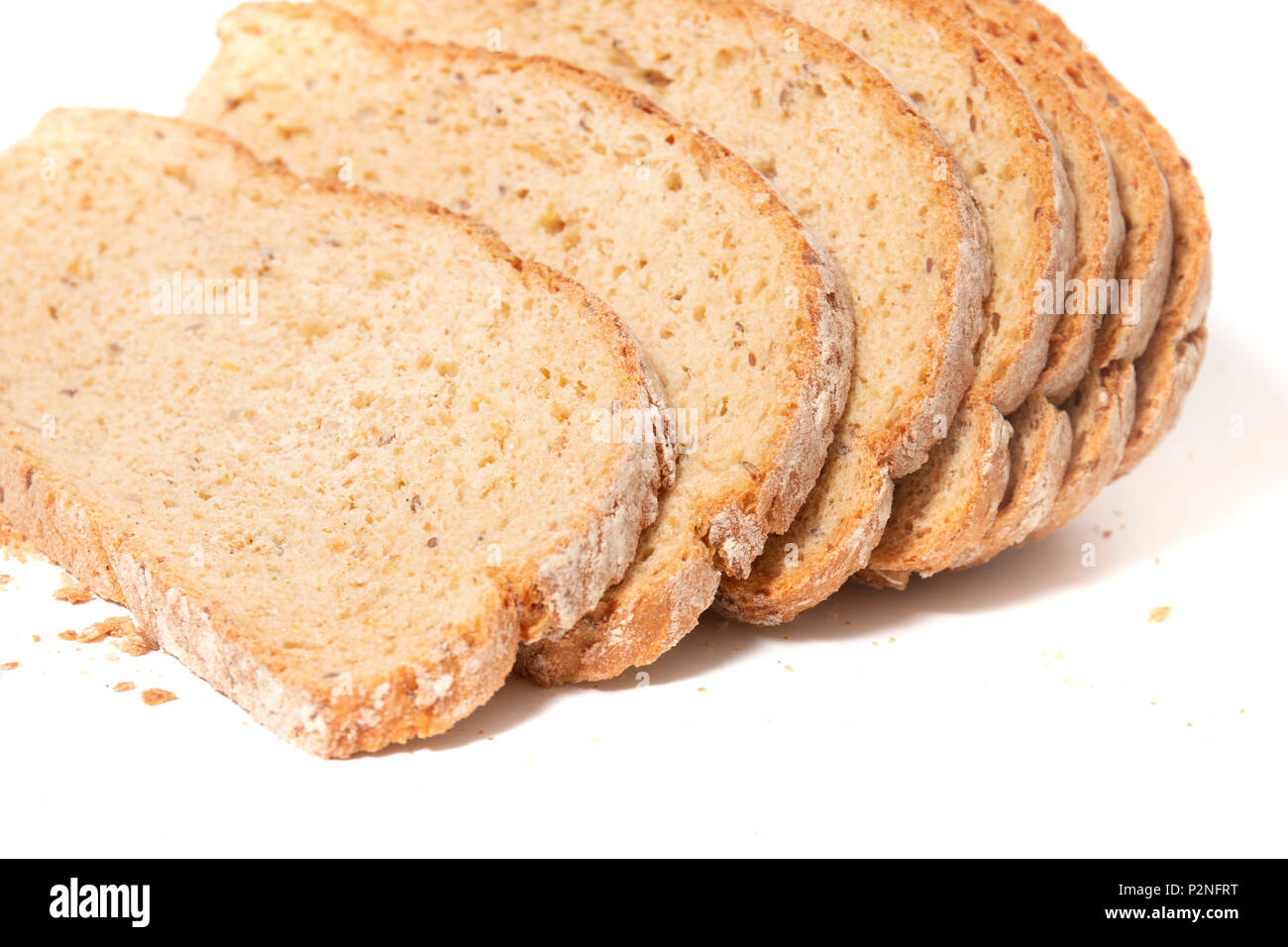 Traditional slices of grain seed bread on white background Stock Photo ...