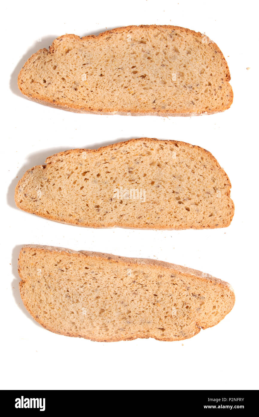 Traditional slices of grain seed bread on white background Stock Photo ...