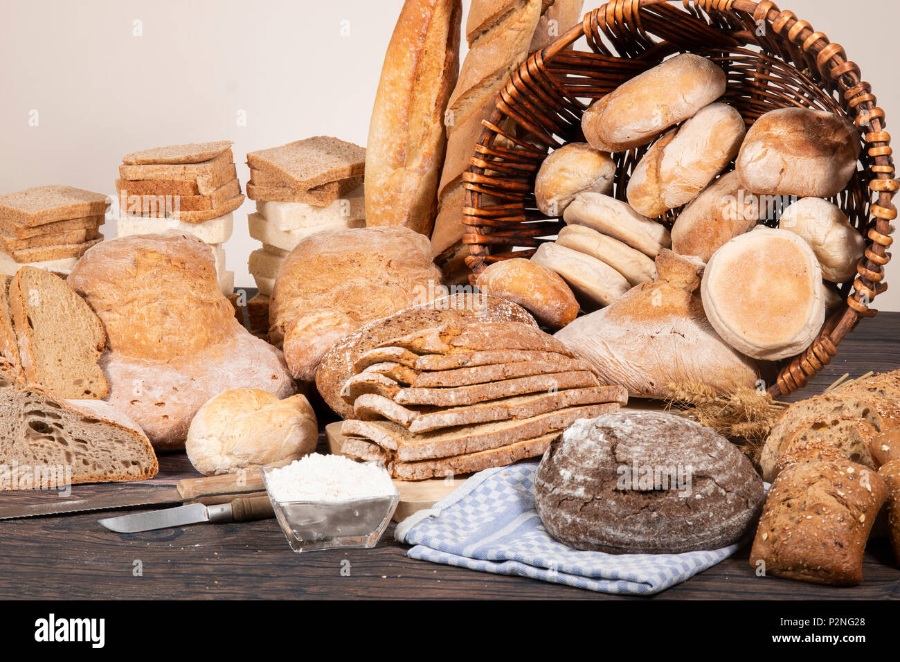 Fresh Assortment of several baked bread varieties on a wooden table ...