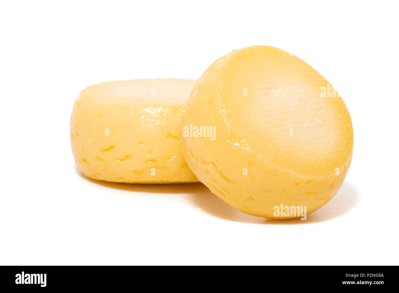 Yellow goat cheese isolated on a white background Stock Photo - Alamy