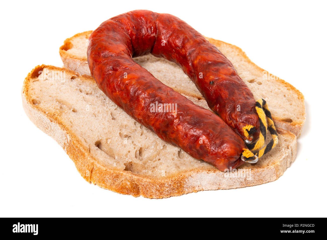 chorizo and traditional bread slices isolated on a white background ...