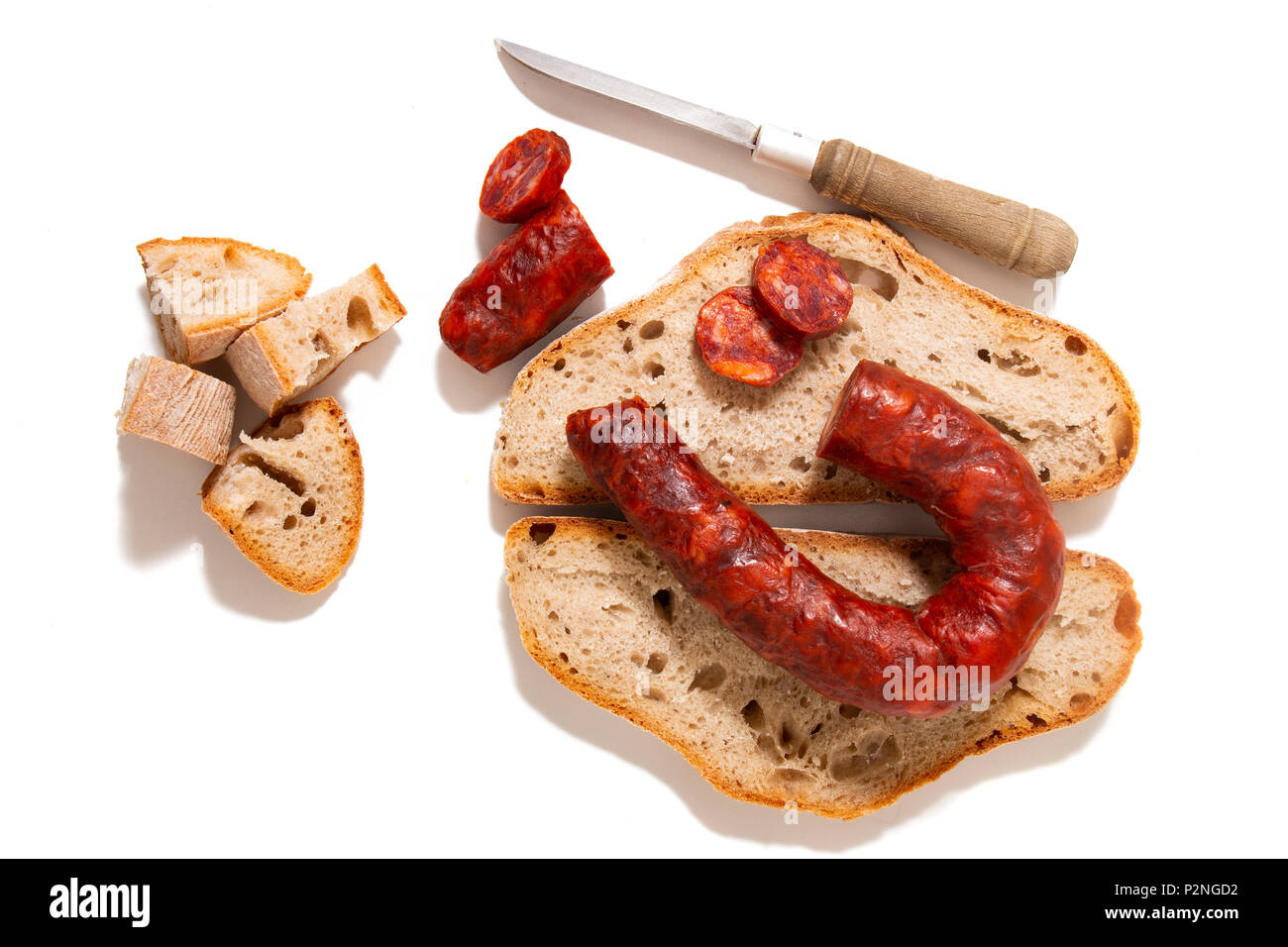 chorizo and traditional bread slices isolated on a white background ...