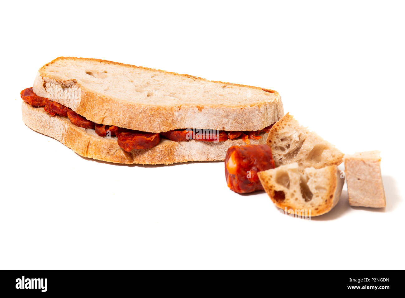 chorizo and traditional bread slices isolated on a white background ...