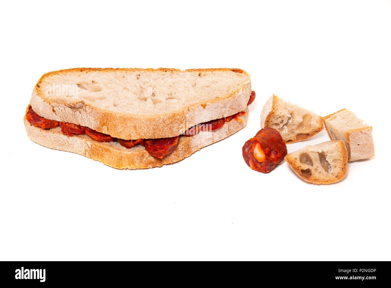 chorizo and traditional bread slices isolated on a white background ...
