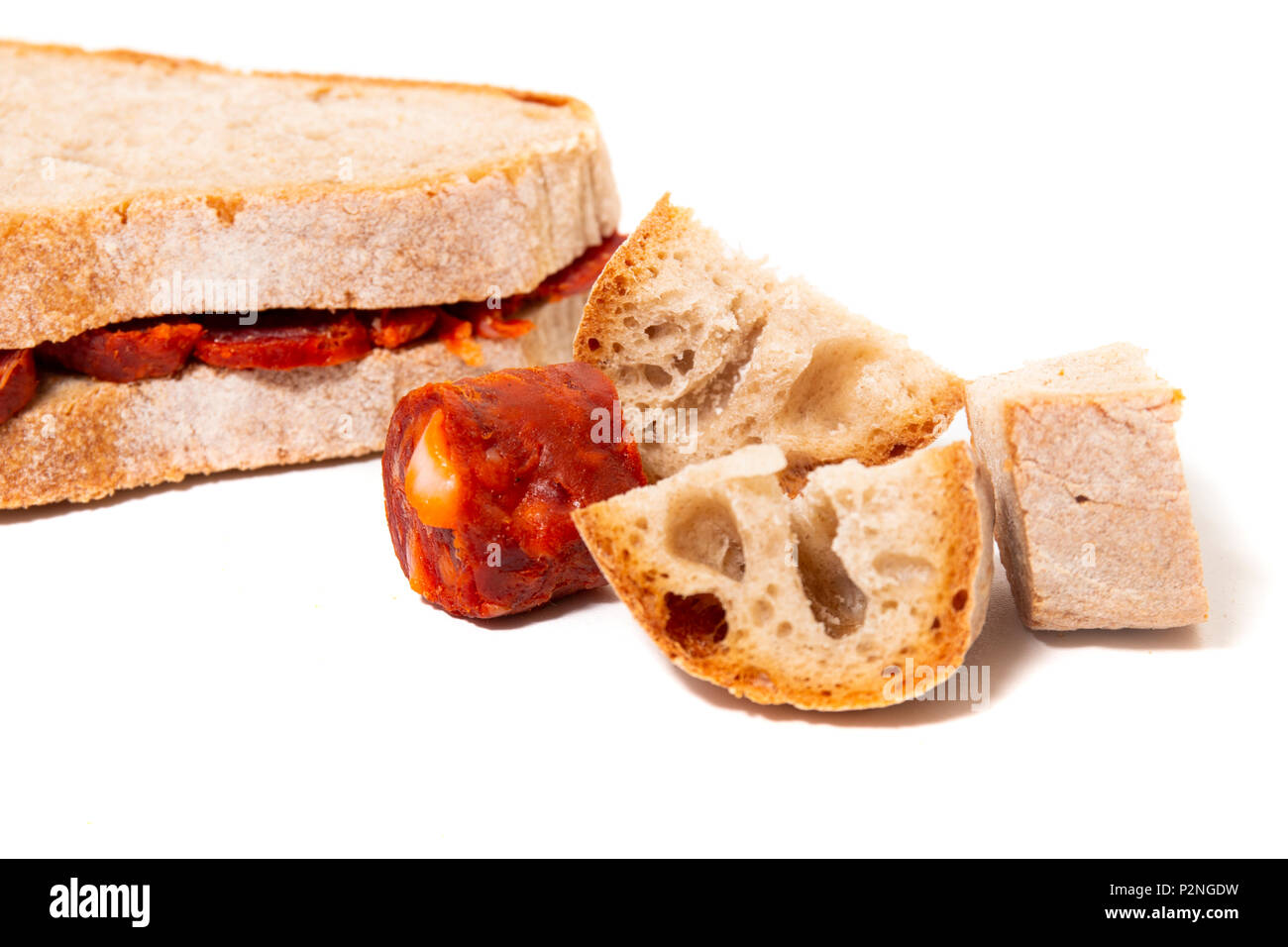 chorizo and traditional bread slices isolated on a white background ...