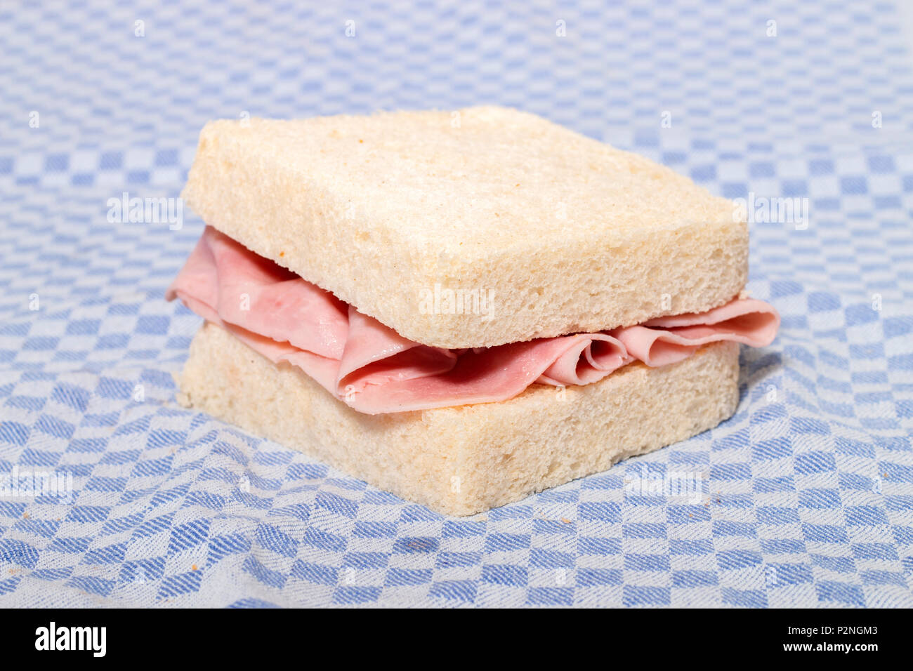 sandwich with ham over a blue cloth Stock Photo - Alamy