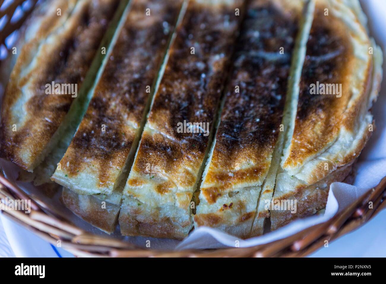Portugal, Madeira Island, traditional bread served rubbed with garlic ...