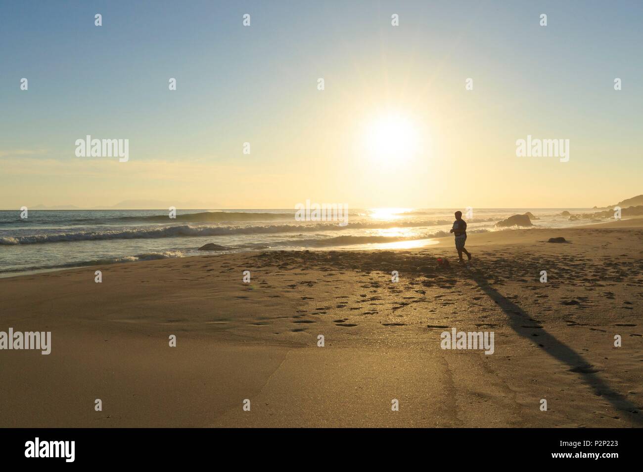 South Africa, Western Cape, Child at Sunset on Pringle Bay Beach Stock ...